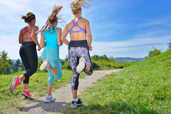 Three Joggers running together outdoors - Stock Image - Everypixel