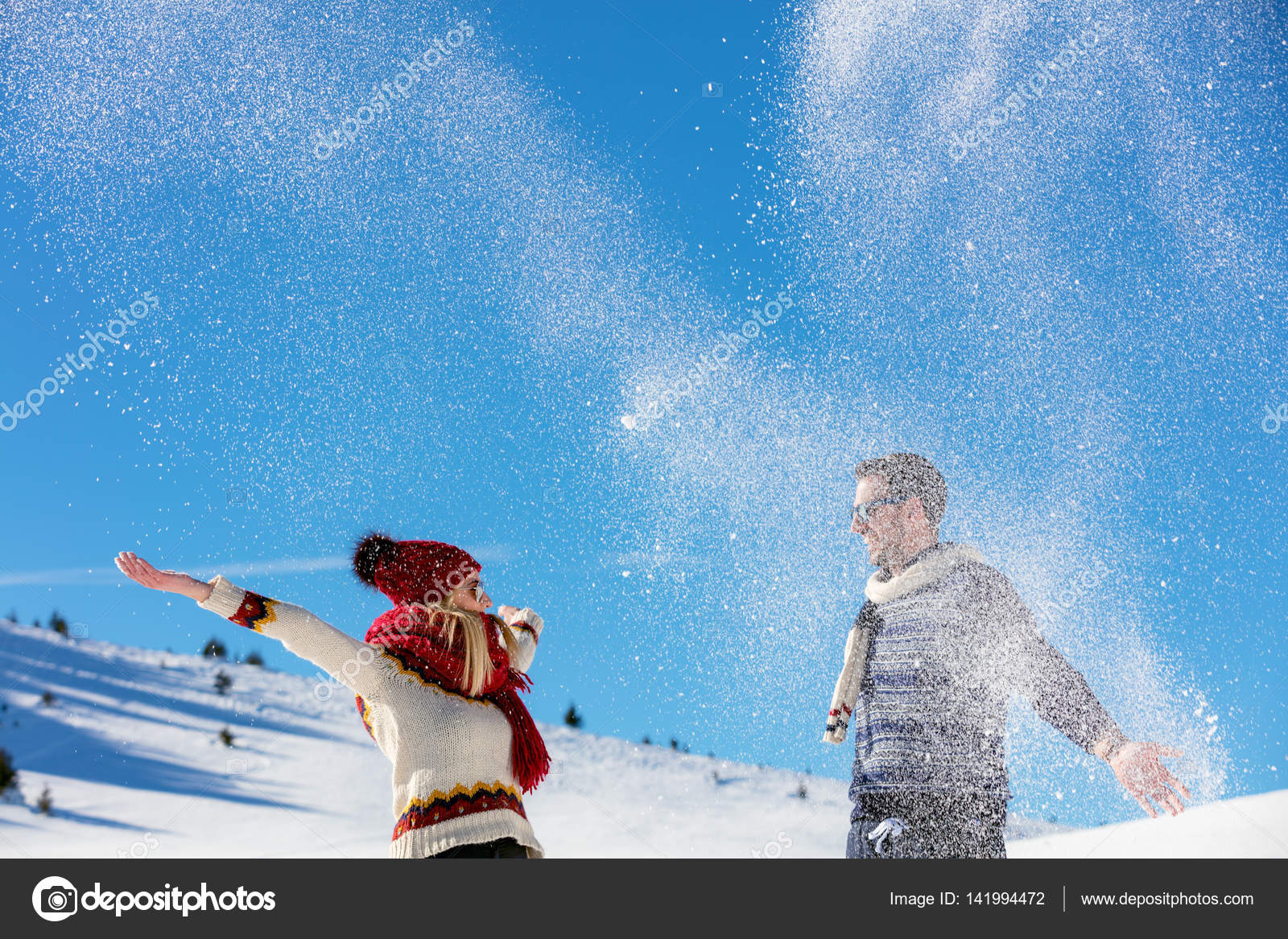 Couple playing Snowball fight. Stock Photo by ©FS-Stock 141994472