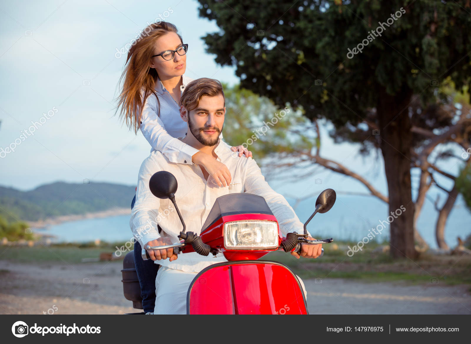 Happy couple riding scooter. — Stock Photo © FS-Stock #147976975 Happy couple riding scooter. — Stock Photo © FS-Stock #147976975