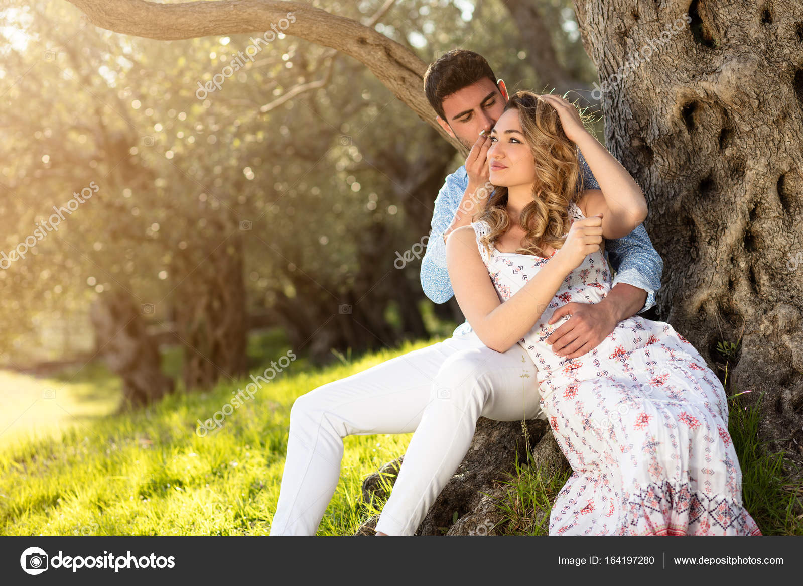 Happy couple under big tree Stock Photo by ©FS-Stock 164197280