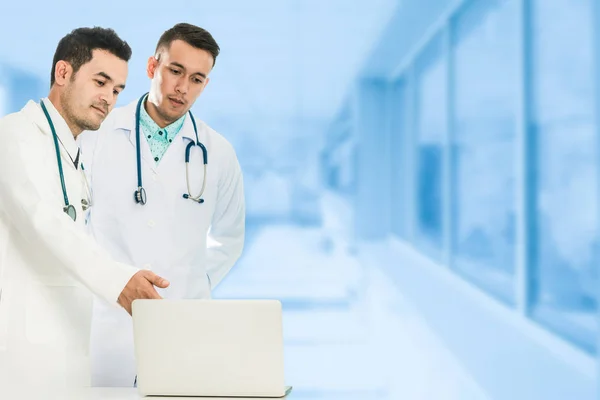 Doctors Discuss Data on Computer - Stock Image - Everypixel