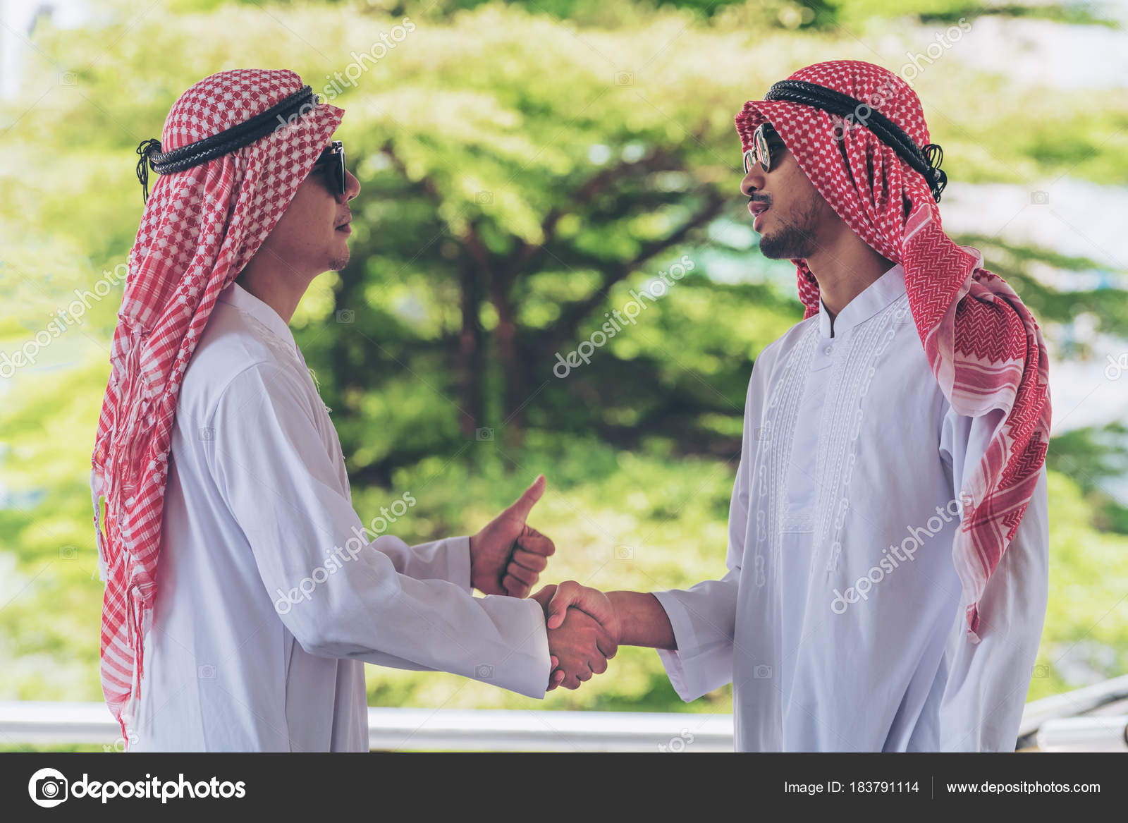 Arab man shaking hands, business success Stock Photo by ©BiancoBlue ...